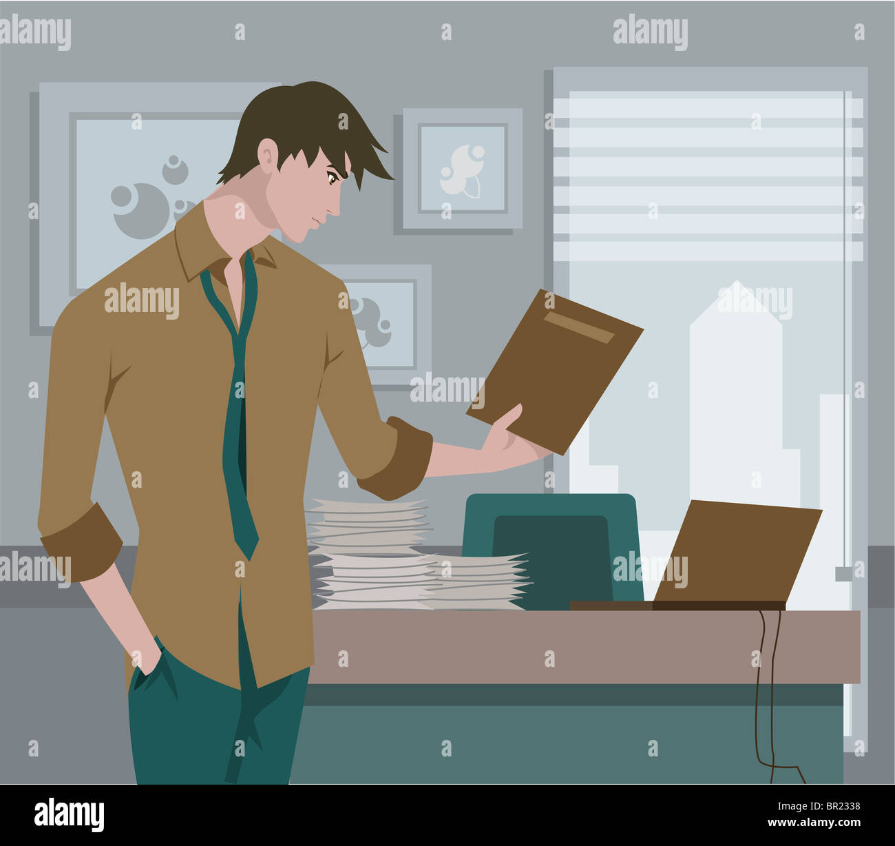 Man looking at a file in an office Stock Photo - Alamy