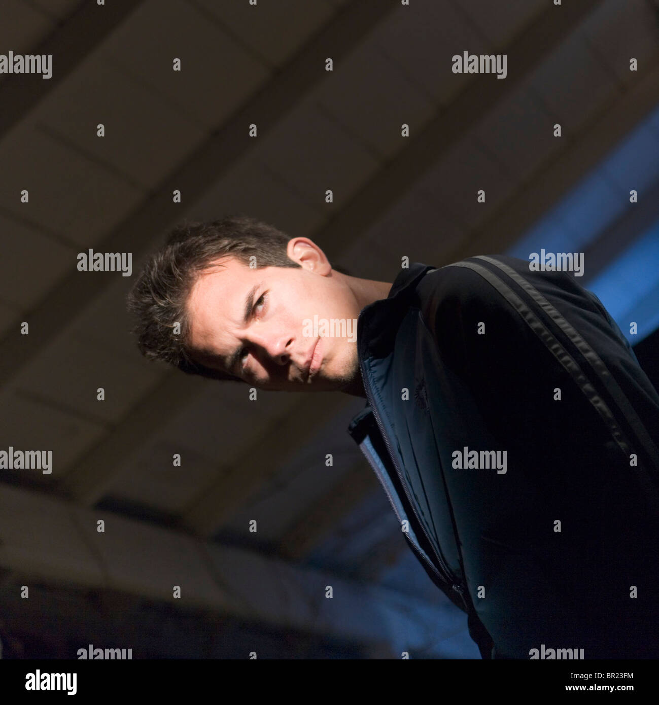 A young man with his head tilted Stock Photo - Alamy
