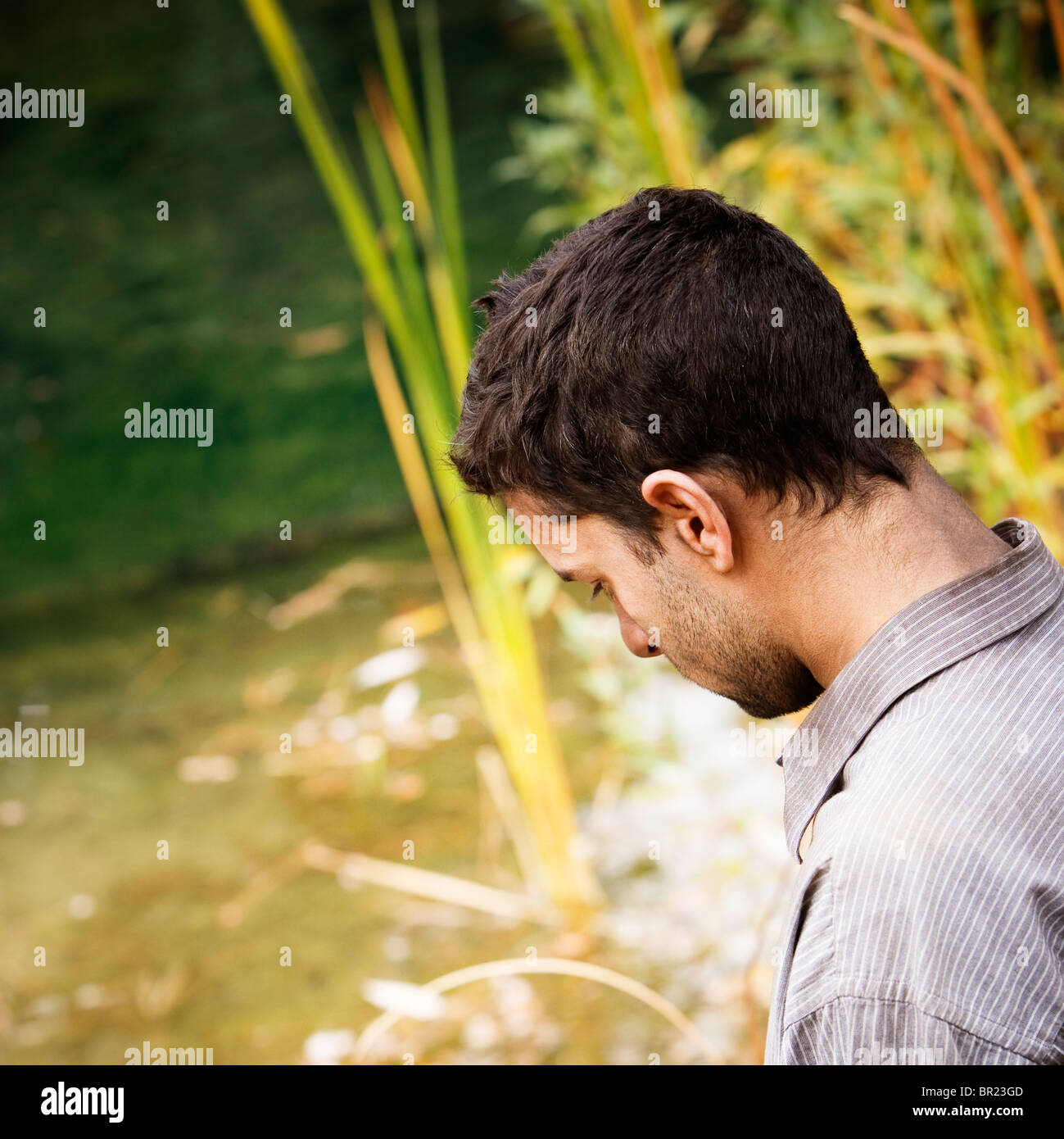 Side view of a man looking down Stock Photo - Alamy