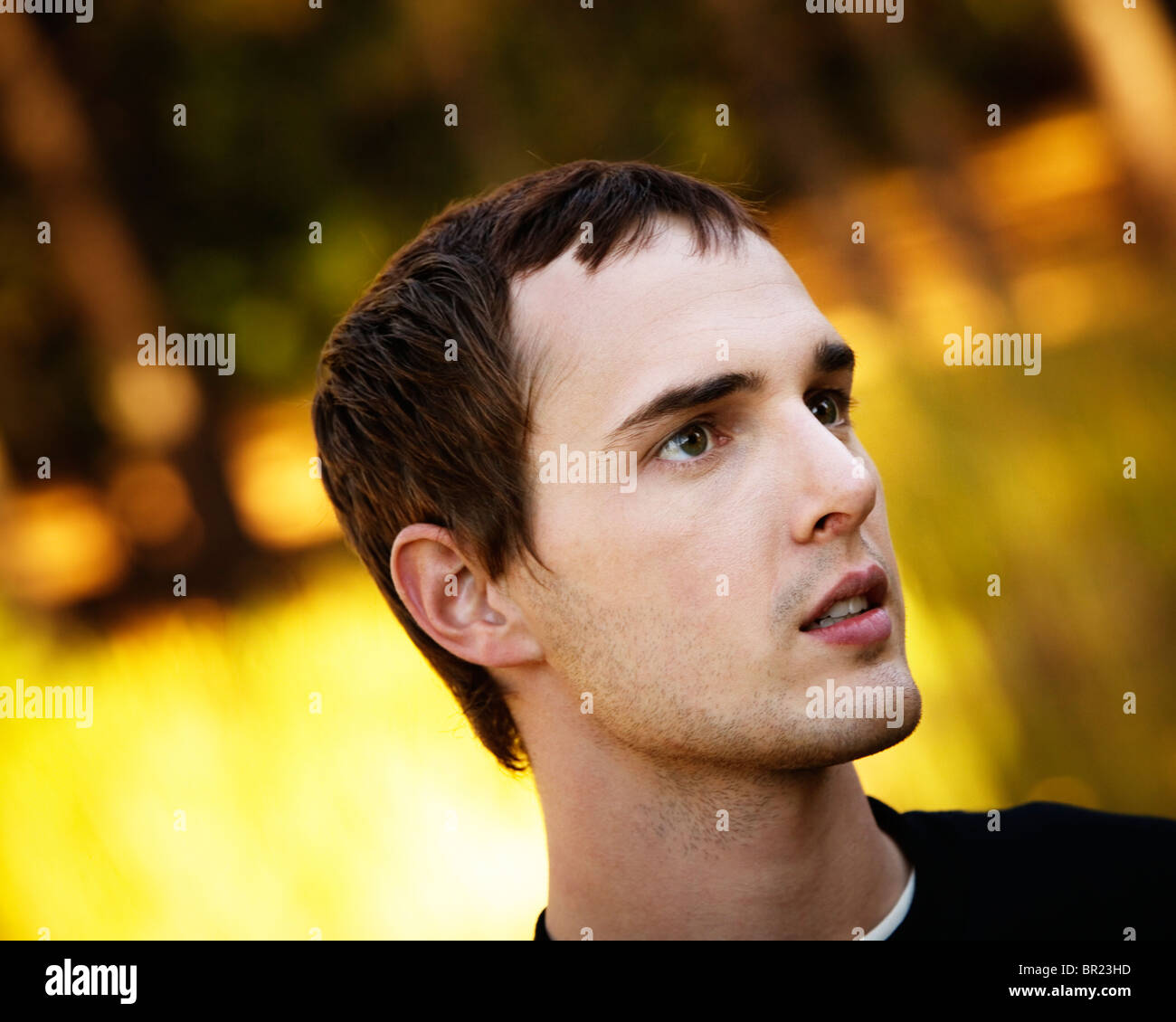A serious portrait of a young man Stock Photo - Alamy