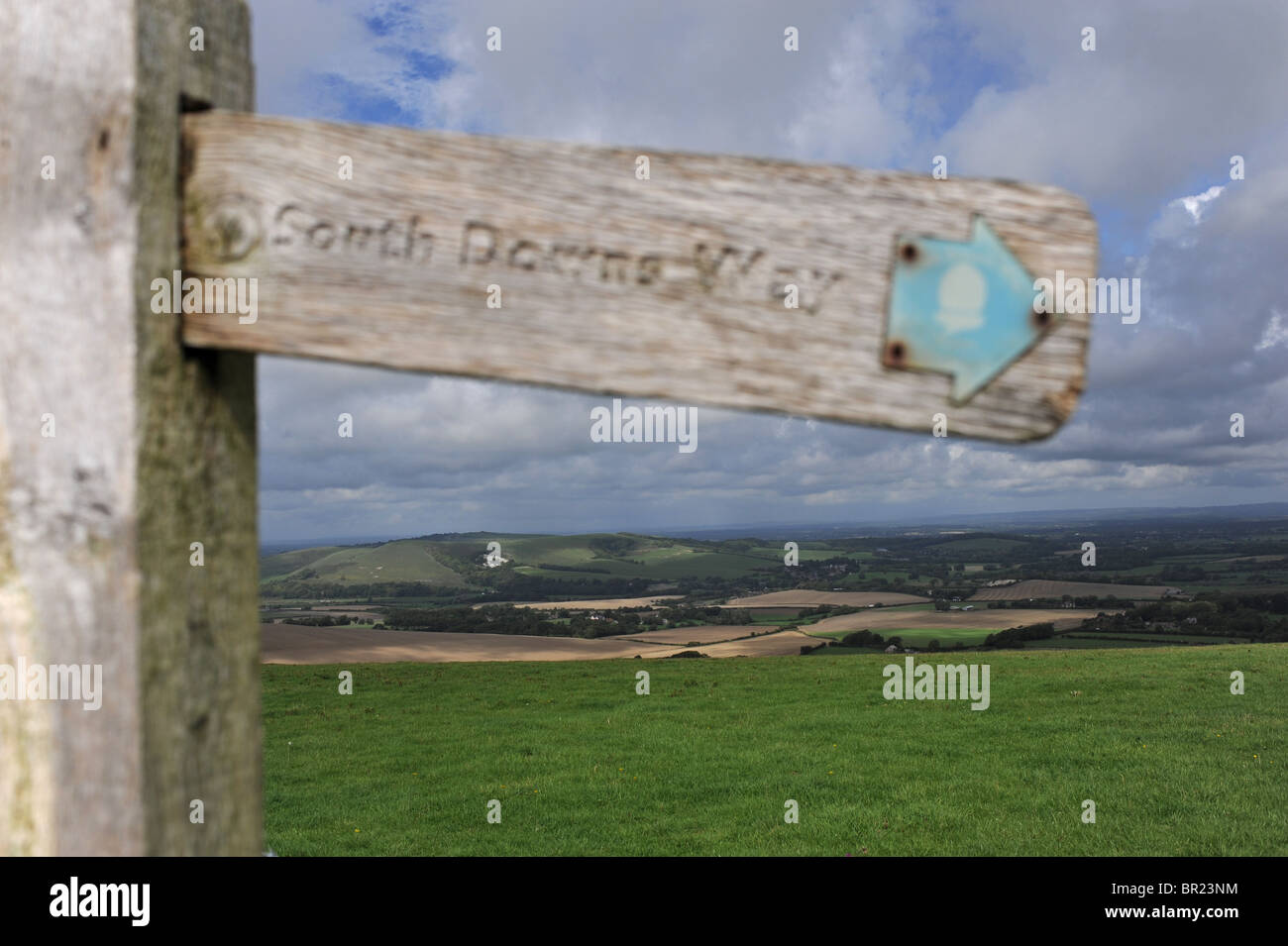 Wooden sign pointing along the South Downs Way at Filre near Lewes East ...