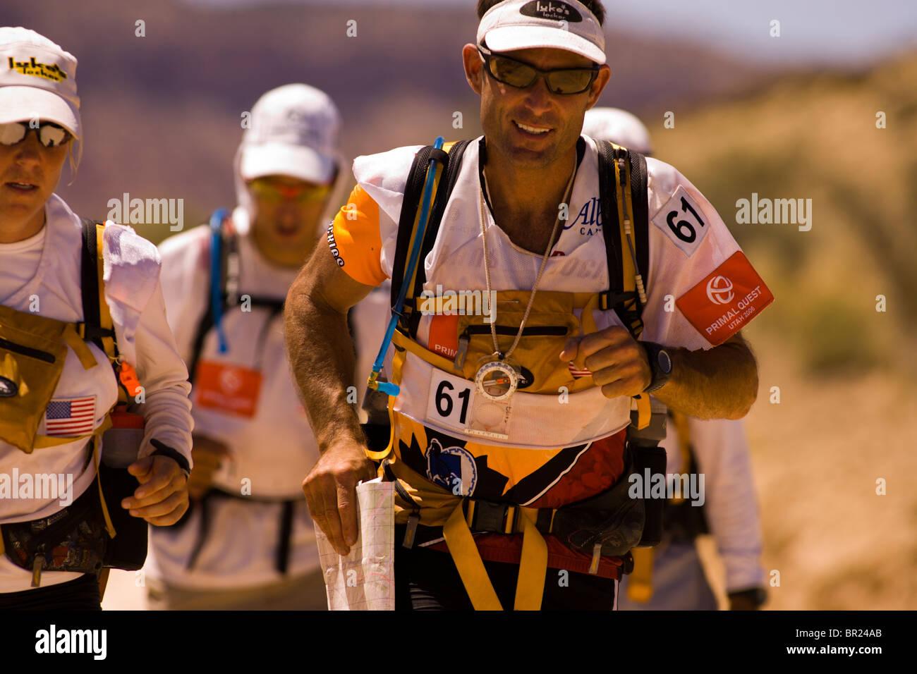 adventure racers running in a pack in a race in Moab, Utah Stock Photo ...