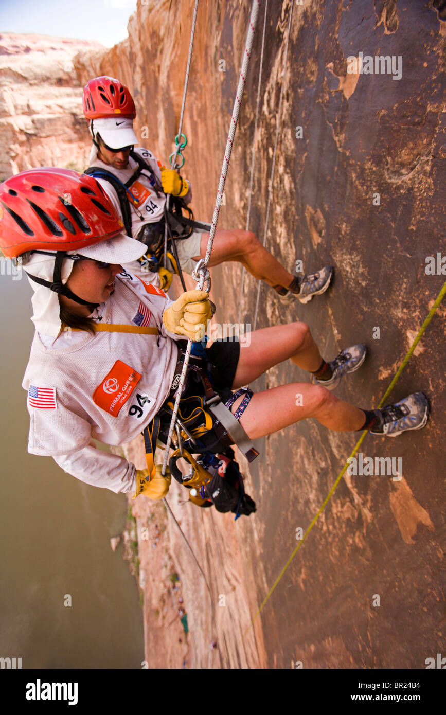 adventure racers rappelling in a race in Moab, Utah (High Angle ...