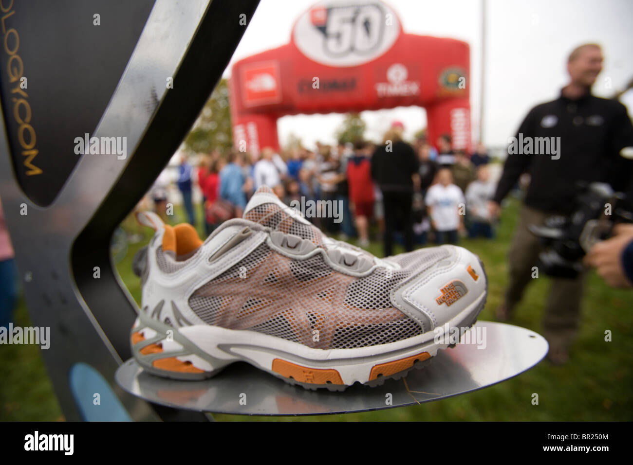 Running shoe on display at finish line of marathon in Portland, Maine ...