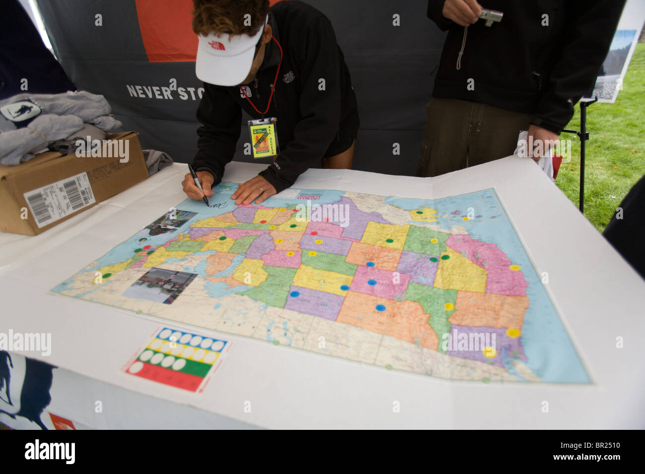 Runner signing a map after a marathon in Portland, Maine Stock Photo ...