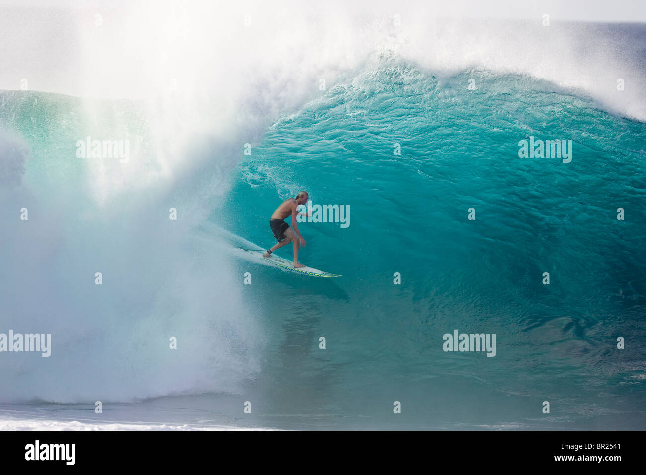 man surfing on a large wave at Pipeline, Hawaii Stock Photo - Alamy