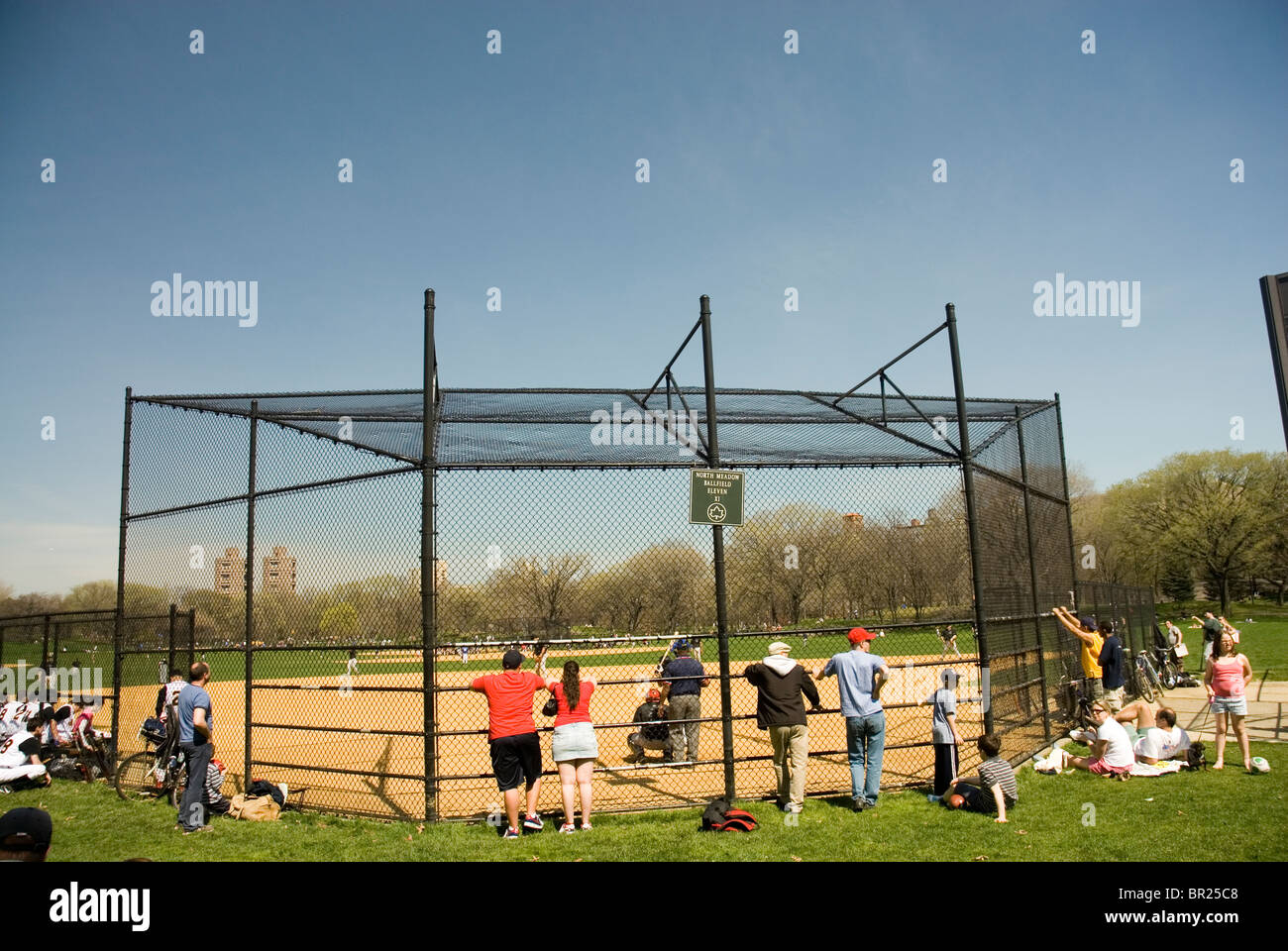 People watching a baseball game in Central Park, New York City Stock ...