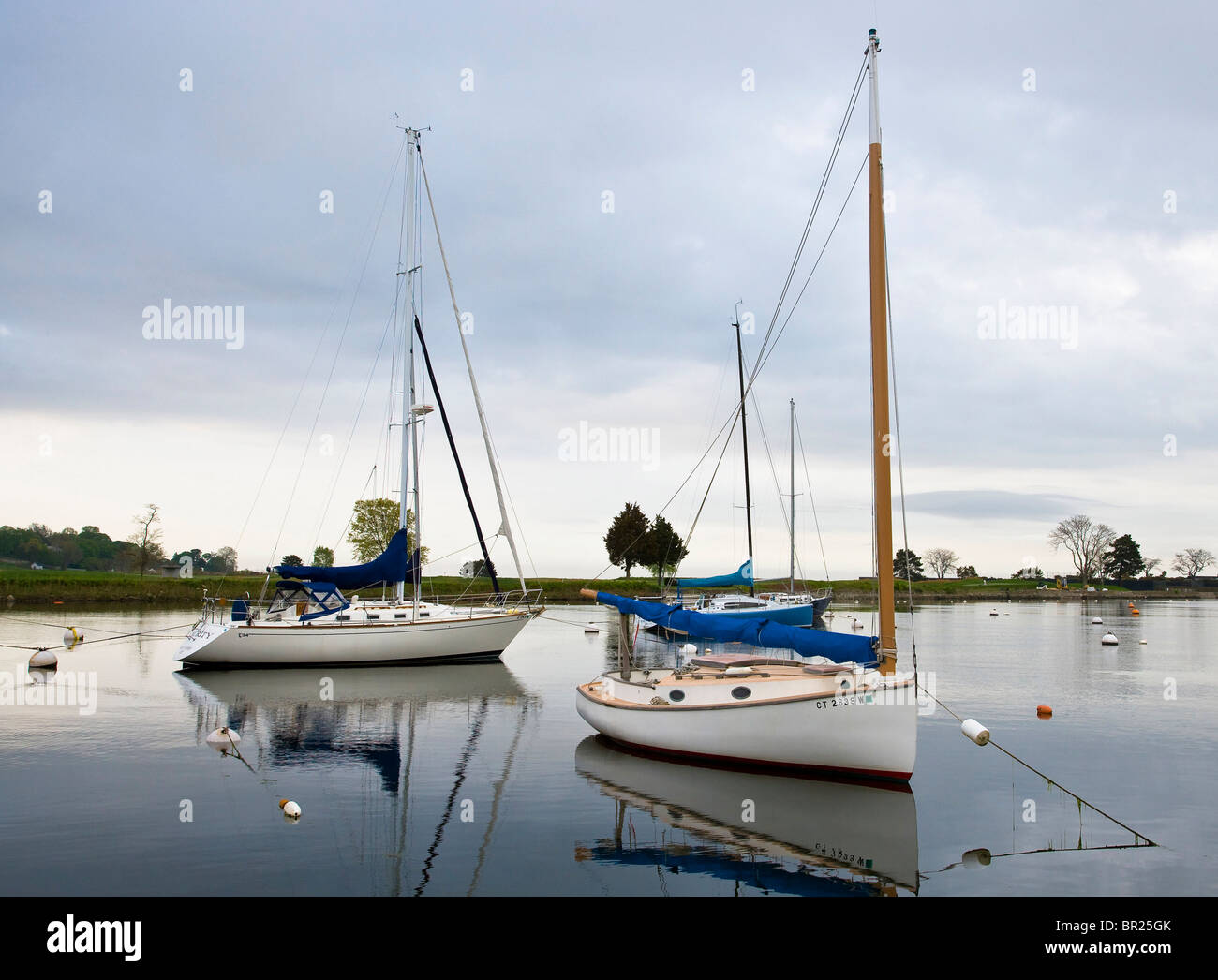 Sail boats rest at anchor Stock Photo - Alamy