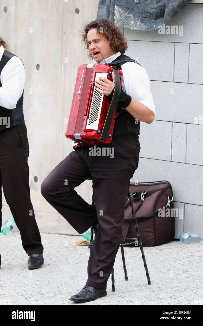 Street musician performer performing on the street, Castle district ...