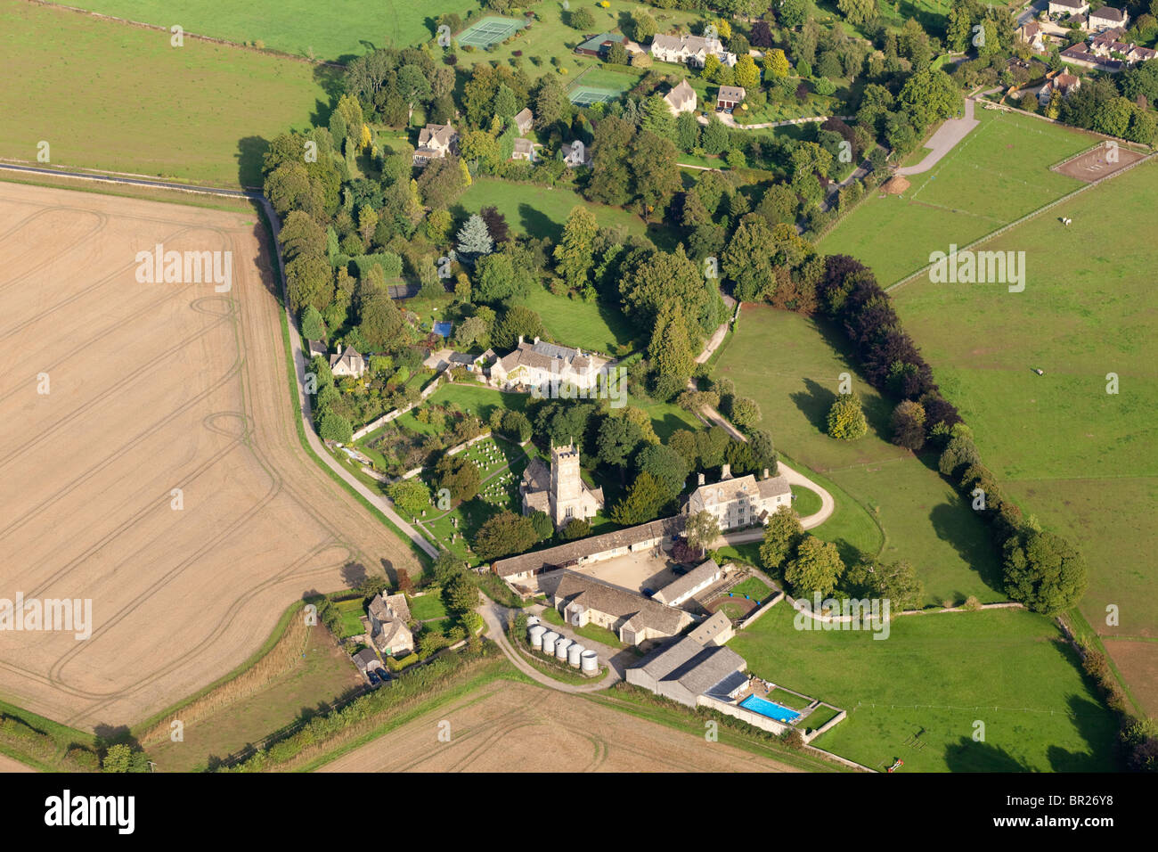 An aerial view of the Cotswold village of Coates, Gloucestershire UK ...