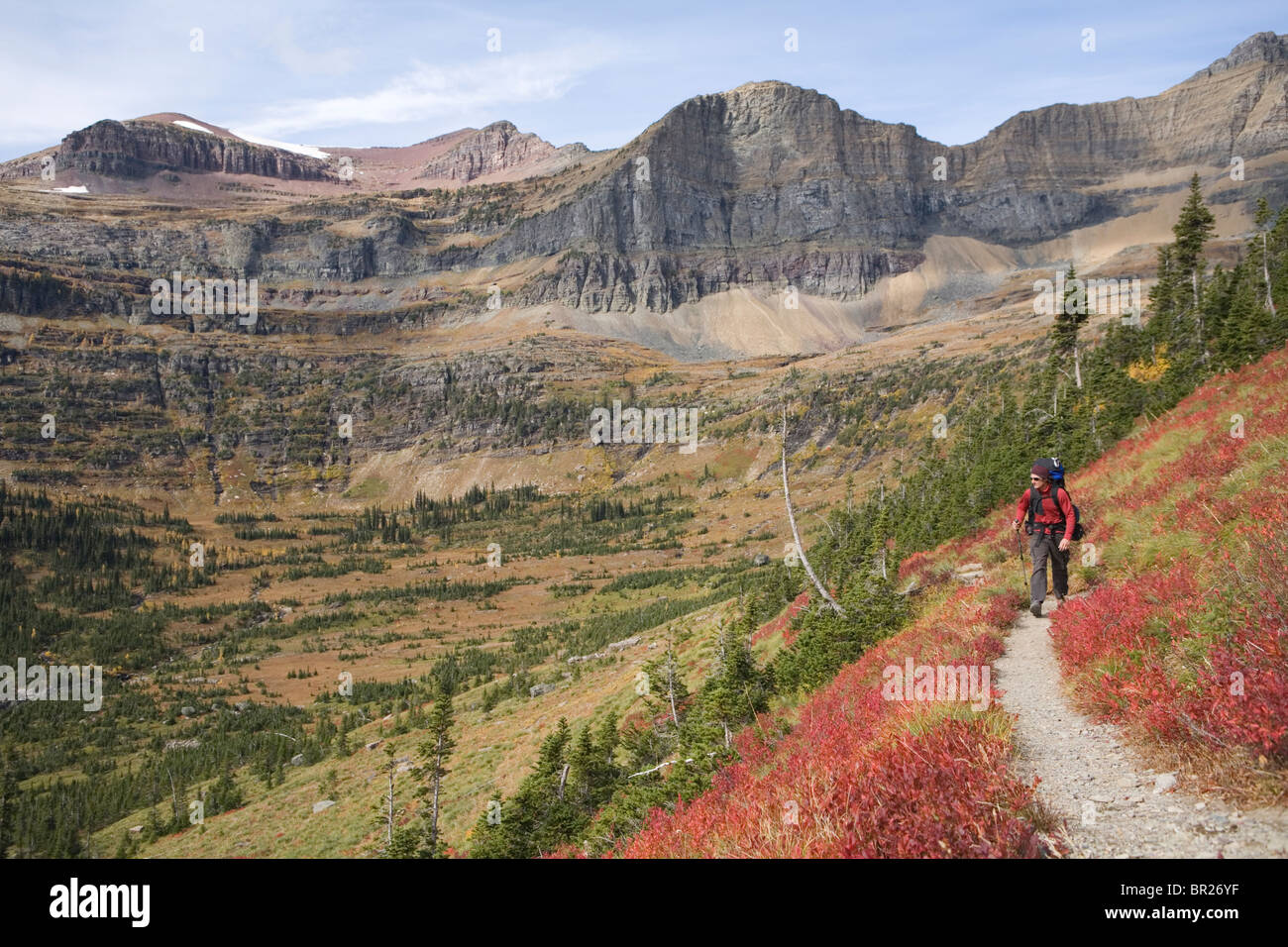 Solo backpaker hikes thorough rough terrain Stock Photo - Alamy
