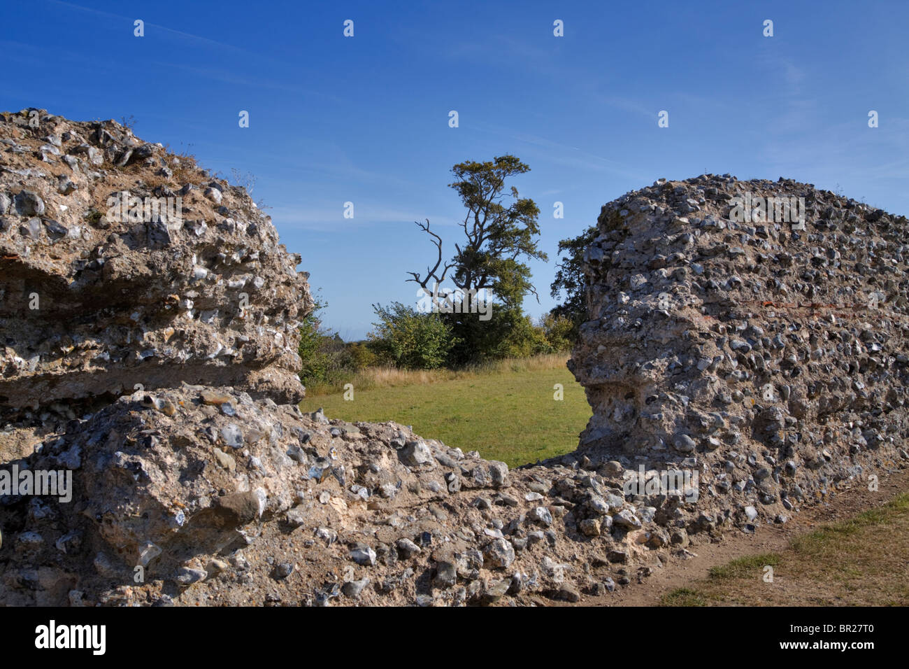 The walls of Burgh Castle are flint and mortar and the wall faces are ...