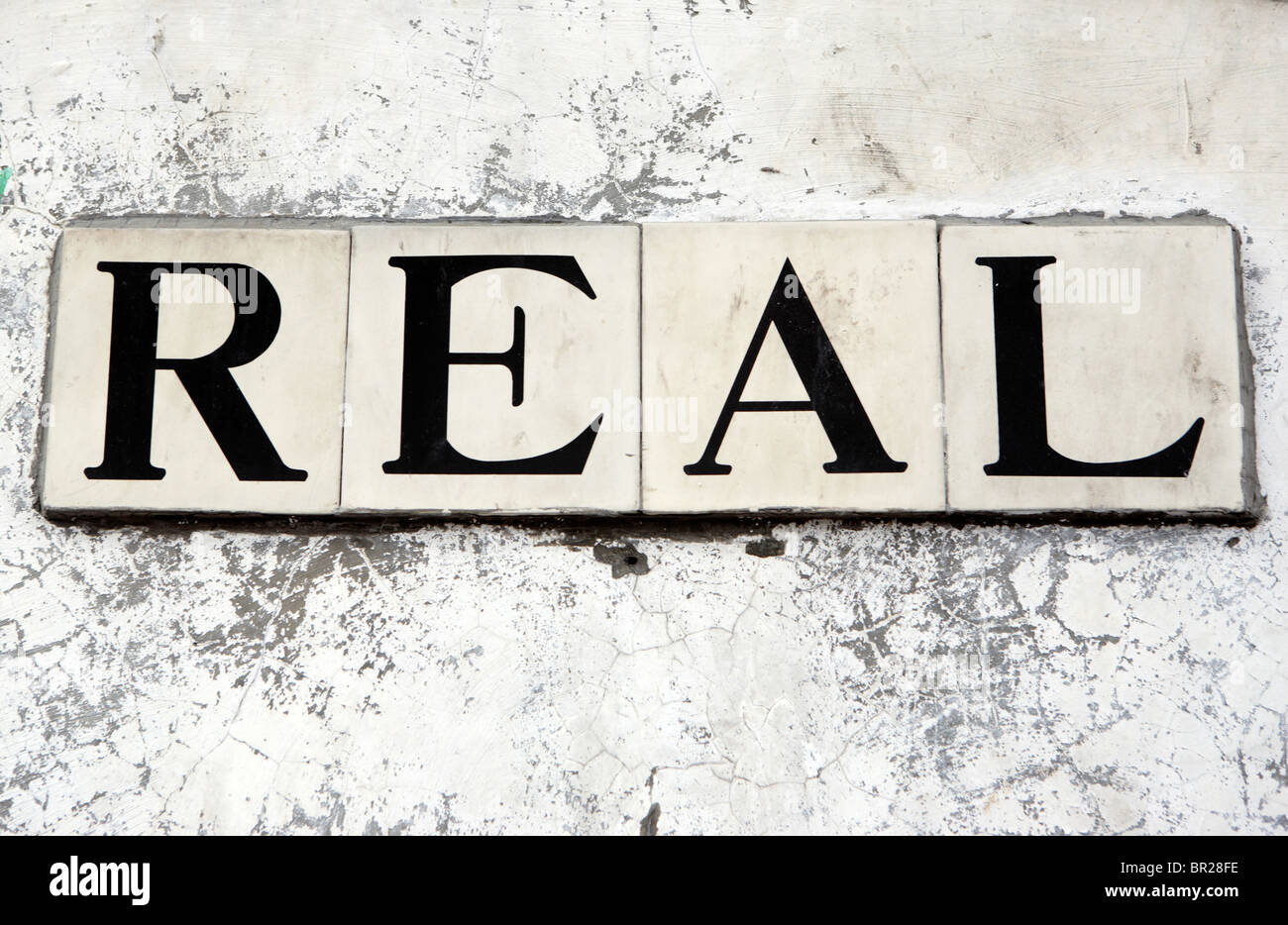 Sign saying REAL Stock Photo - Alamy