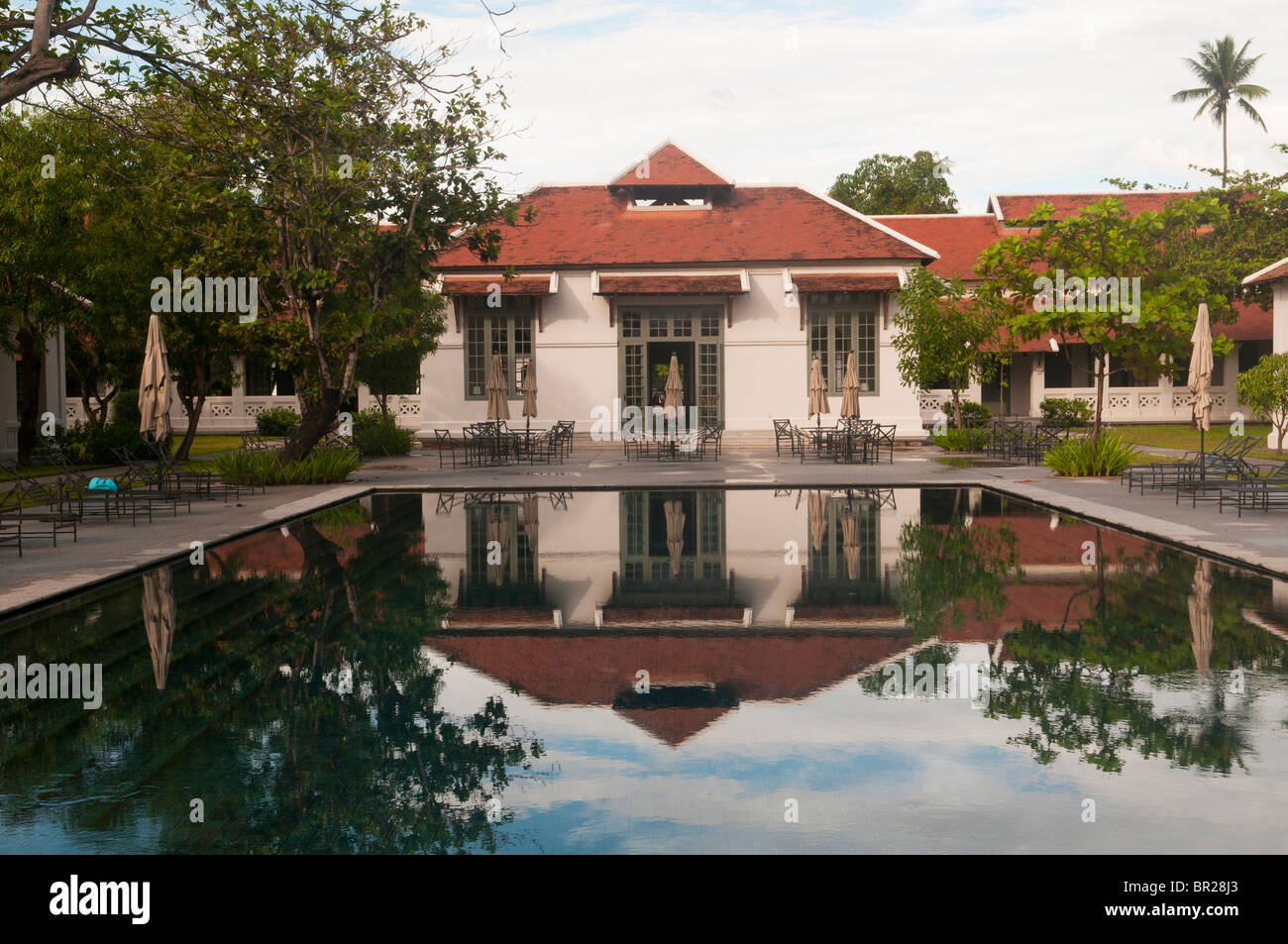pool and reflection at elegant French colonial style home in Luang ...