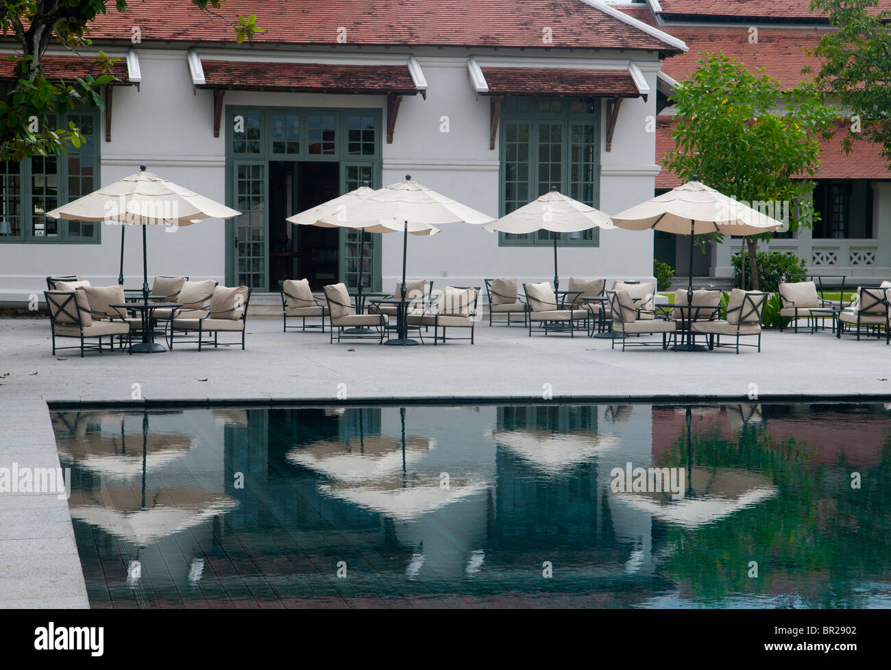 pool and reflection at elegant French colonial style home in Luang ...
