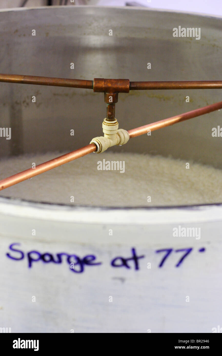 Mash tun in a microbrewery with the sparge arm ready to spray water ...