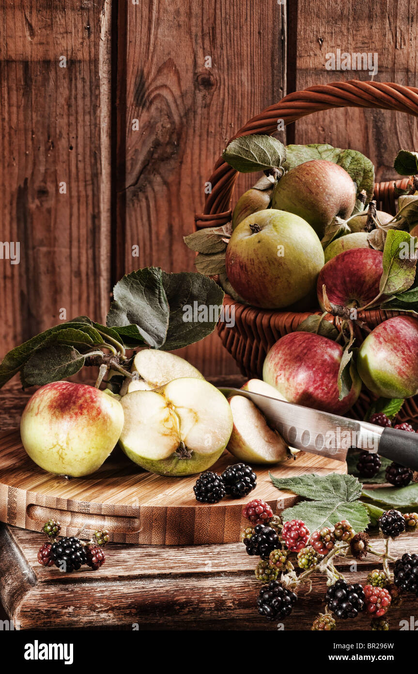 Rustic apples from the orchard with hedgerow blackberries with vintage ...