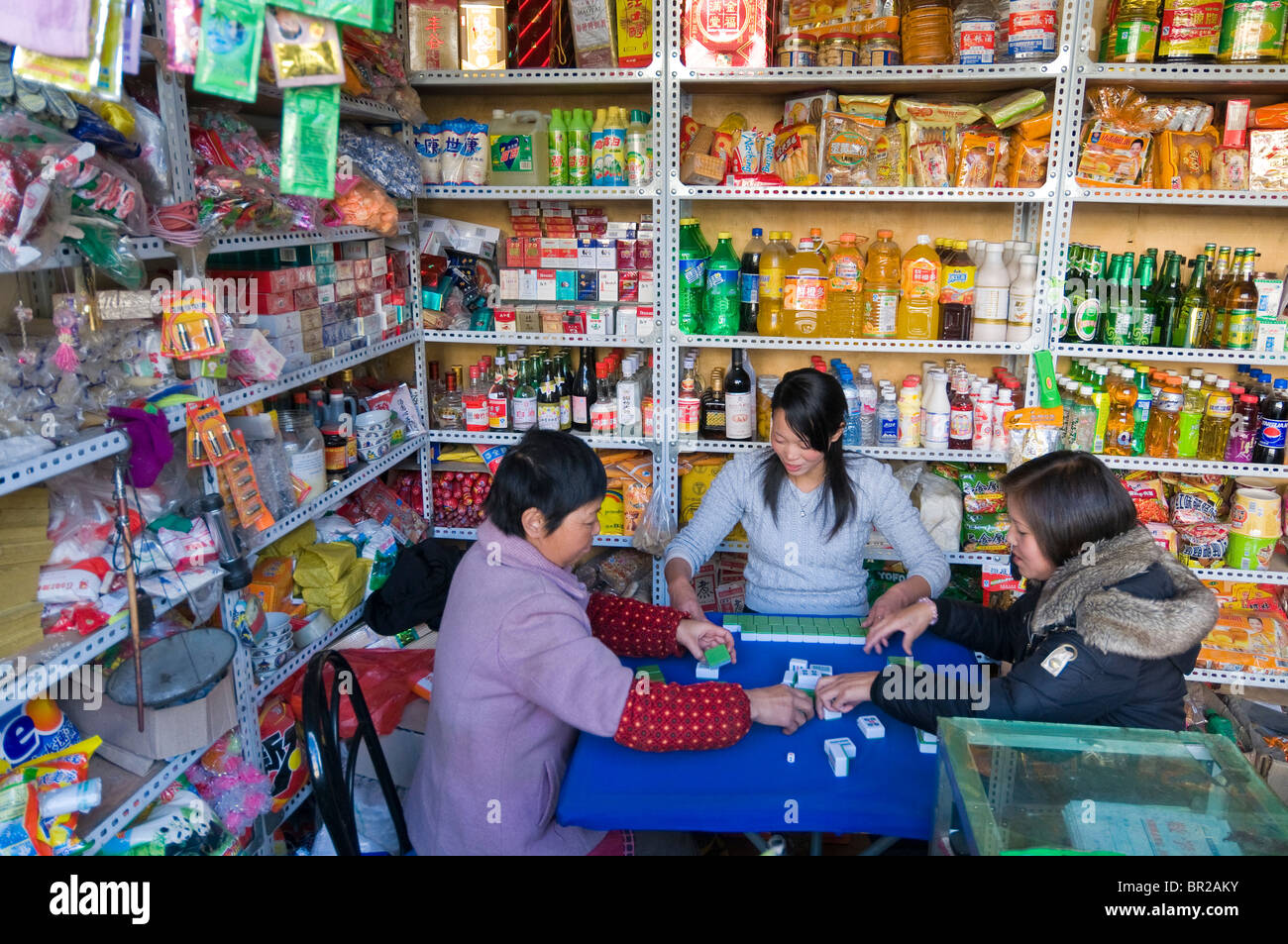 Shop owner and friends play mahjong, Xin Du Qiao, Sichuan Province ...