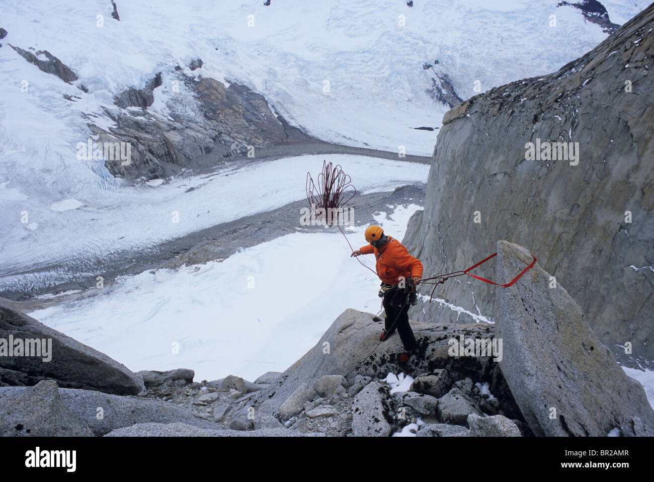 A climber prepares to rappel from halfway up the SW Pillar of Cerro ...