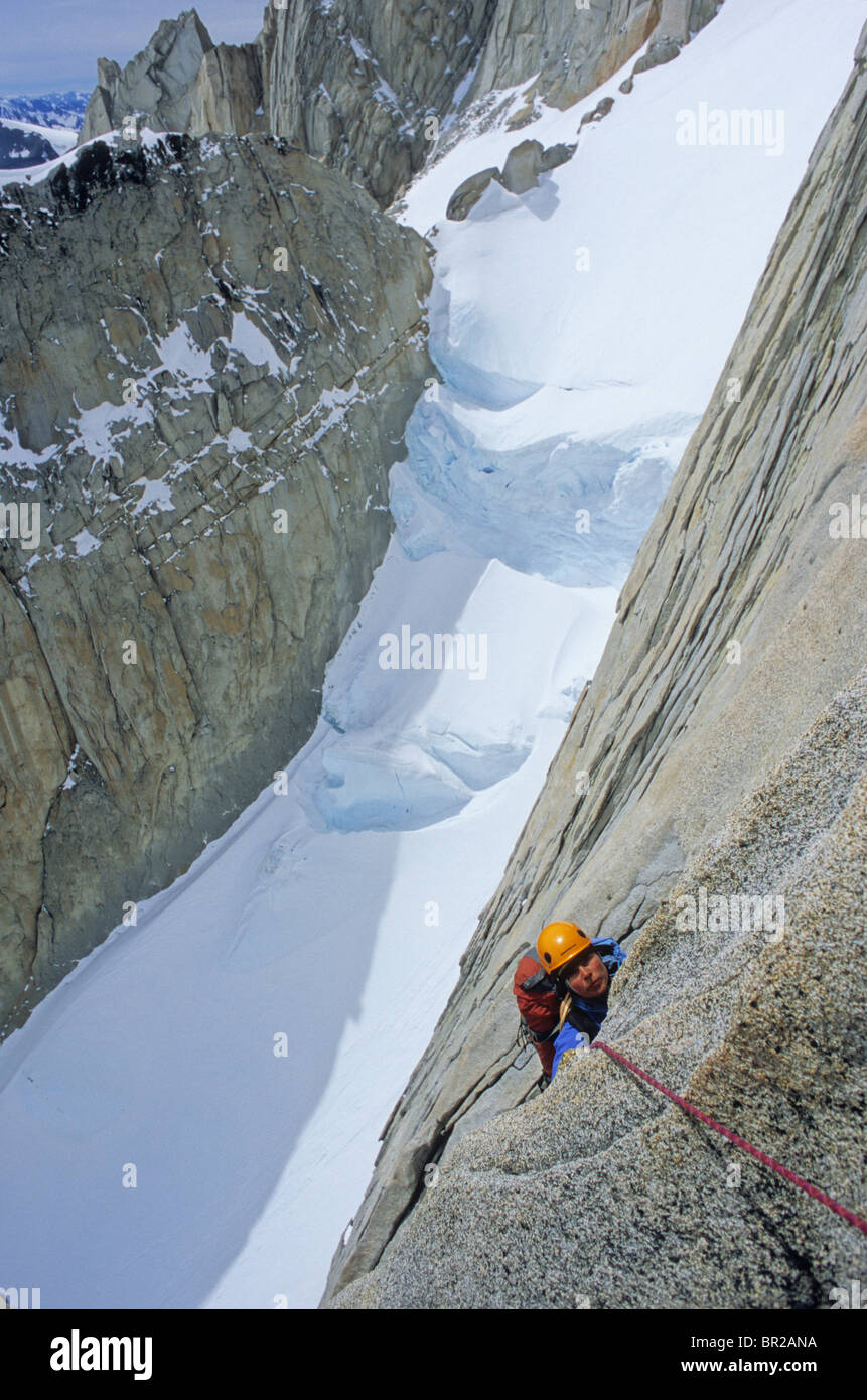 A climber follows a pitch halfway up the Southwest Pillar of Cerro ...