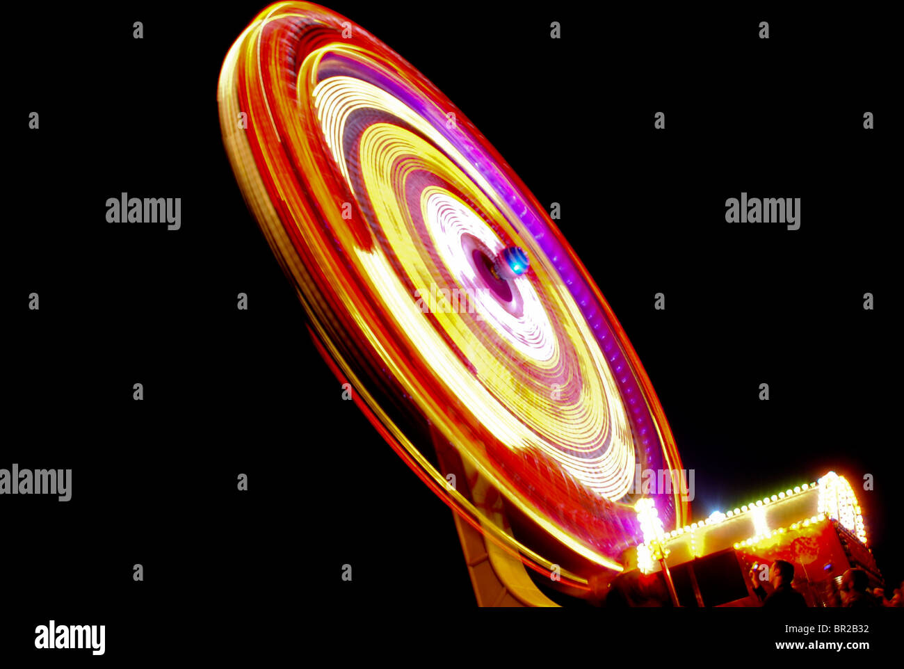 Merry-go-round at high speed Stock Photo - Alamy