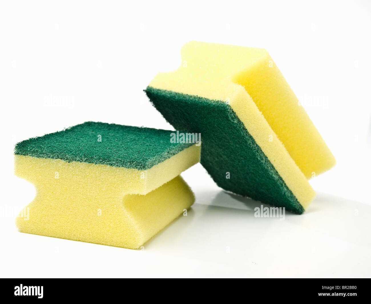 two sponges against white background, studio shot Stock Photo - Alamy
