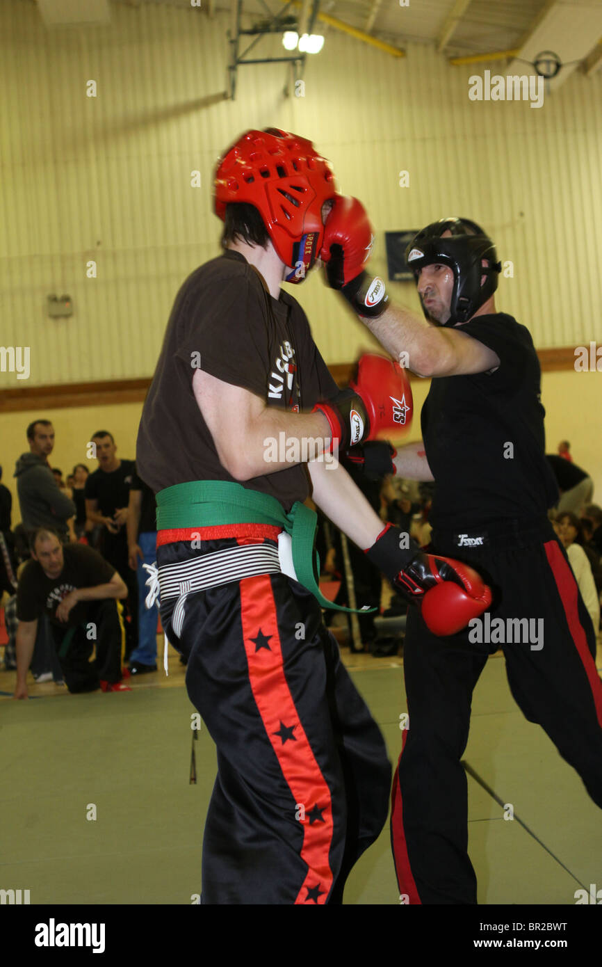 Competitors fighting in a kickboxing tournament Stock Photo - Alamy