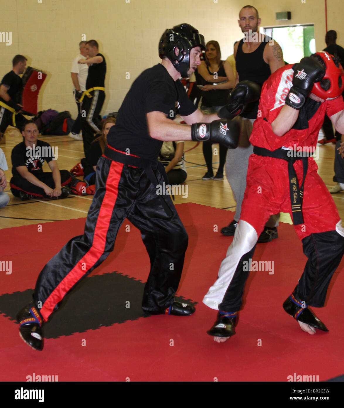 Competitors fighting in a kickboxing tournament Stock Photo - Alamy