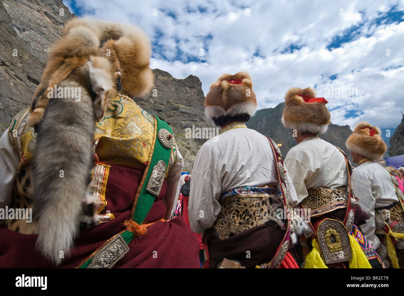 Animal fur hat with long tail adorn Ethnic Tibetan male dancer at folk ...