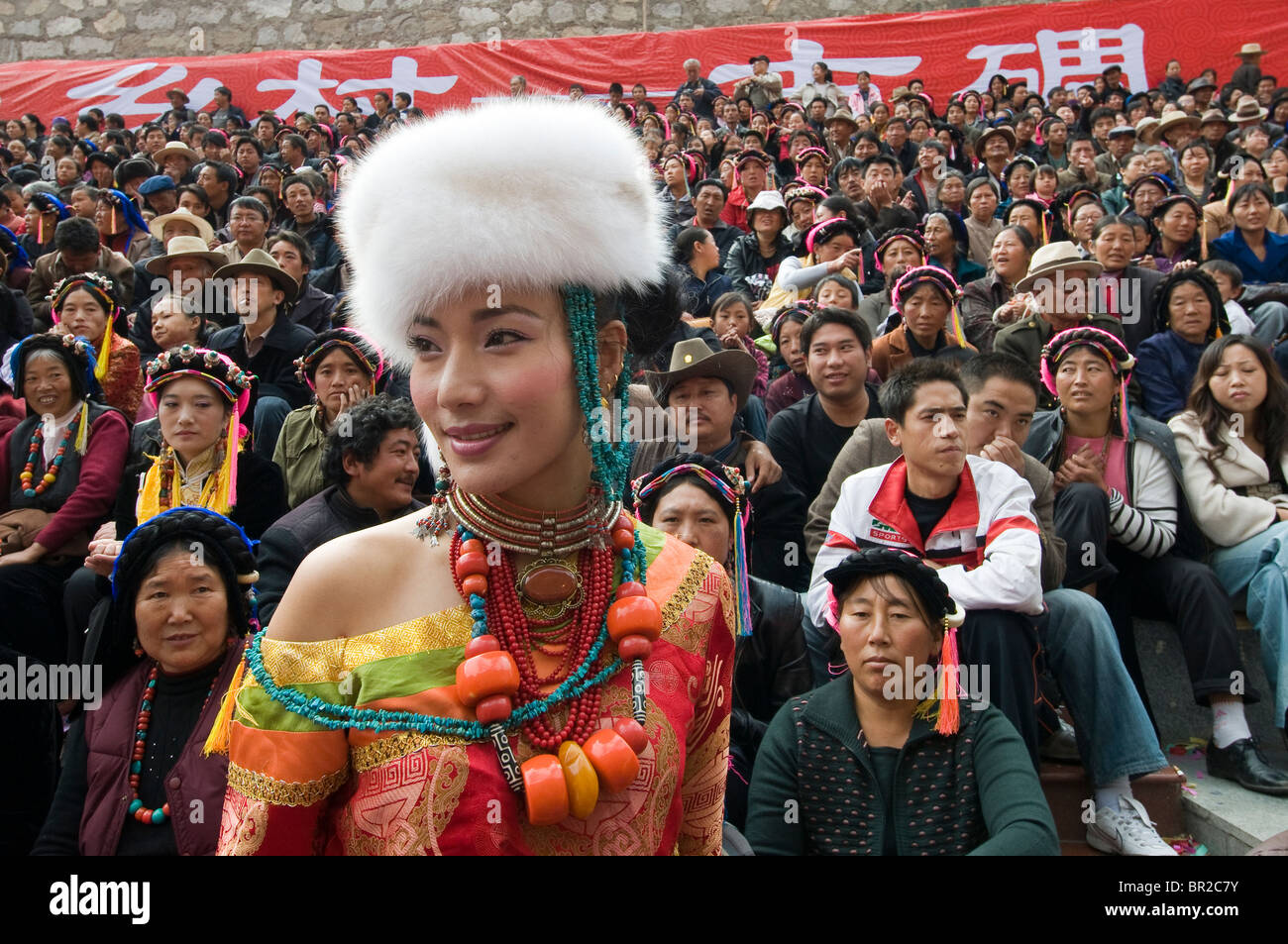 Singer wearing Ethnic Tibetan costume and jewelry waits to perform at ...