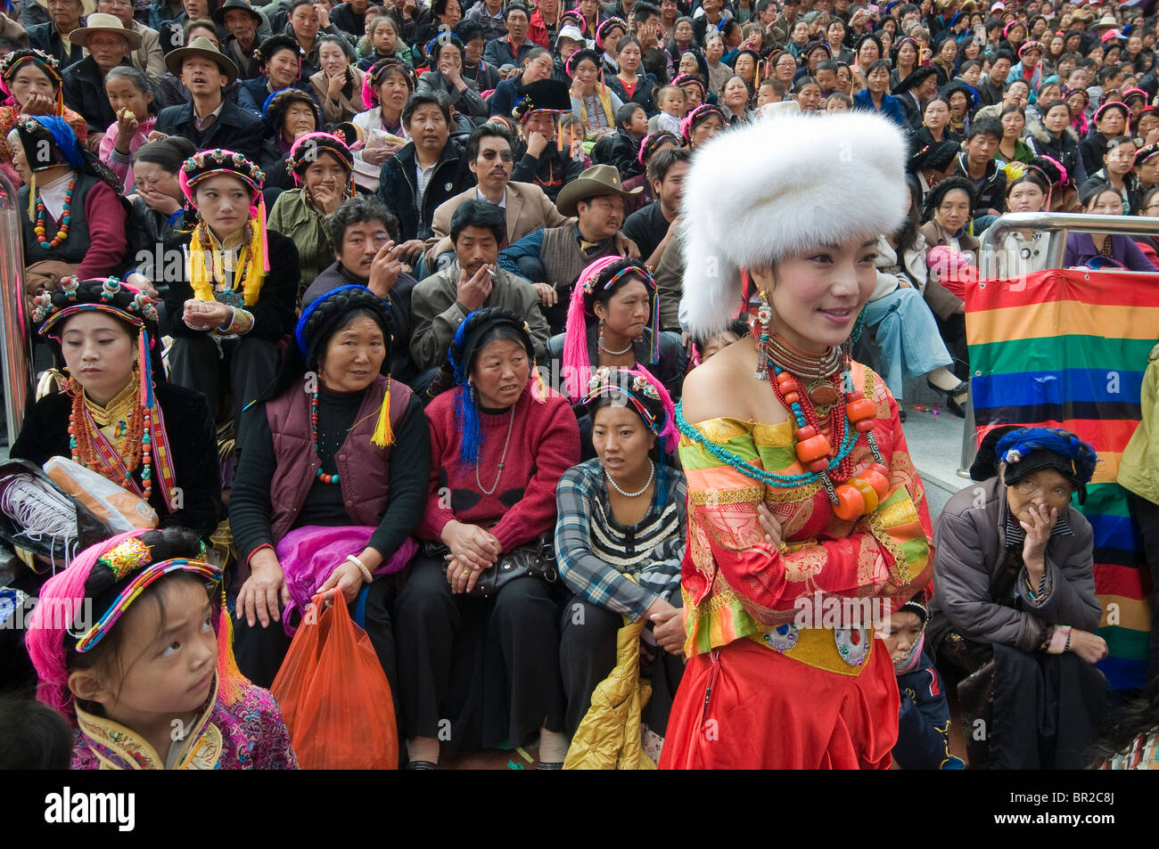 Singer wearing Ethnic Tibetan costume and jewelry waits to perform at ...