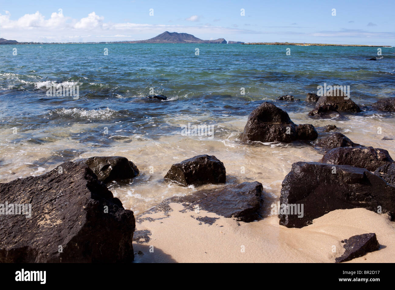 Lava rocks, ocean, mountains landscape in Hawaii Stock Photo - Alamy