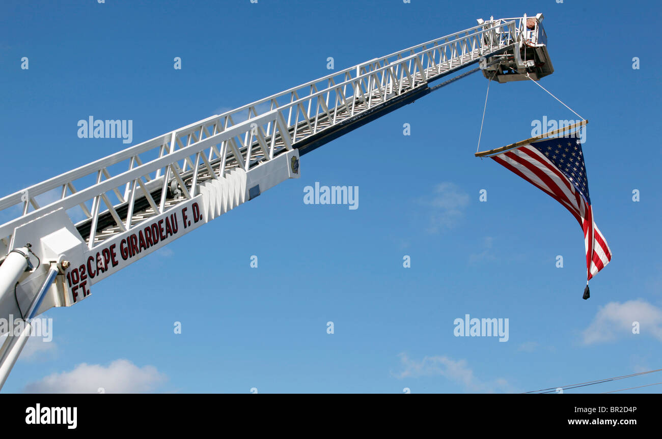 An American flag flies from a fire engine during the closing ceremony ...