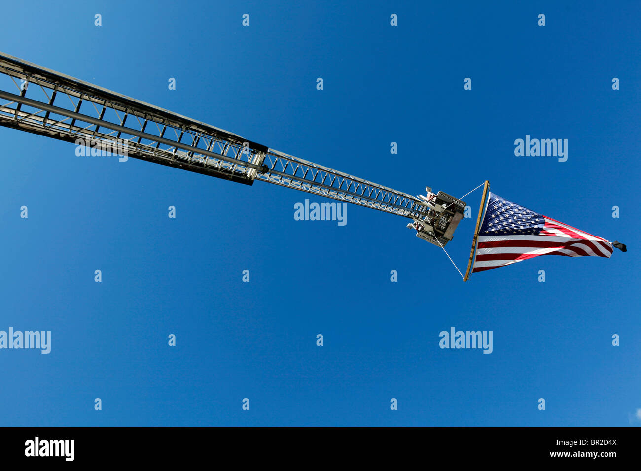 An American flag flies from a fire engine during the closing ceremony ...