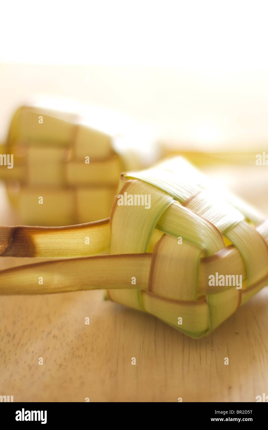 Ketupat, Malaysian sticky rice packets woven from pandan leaves and ...