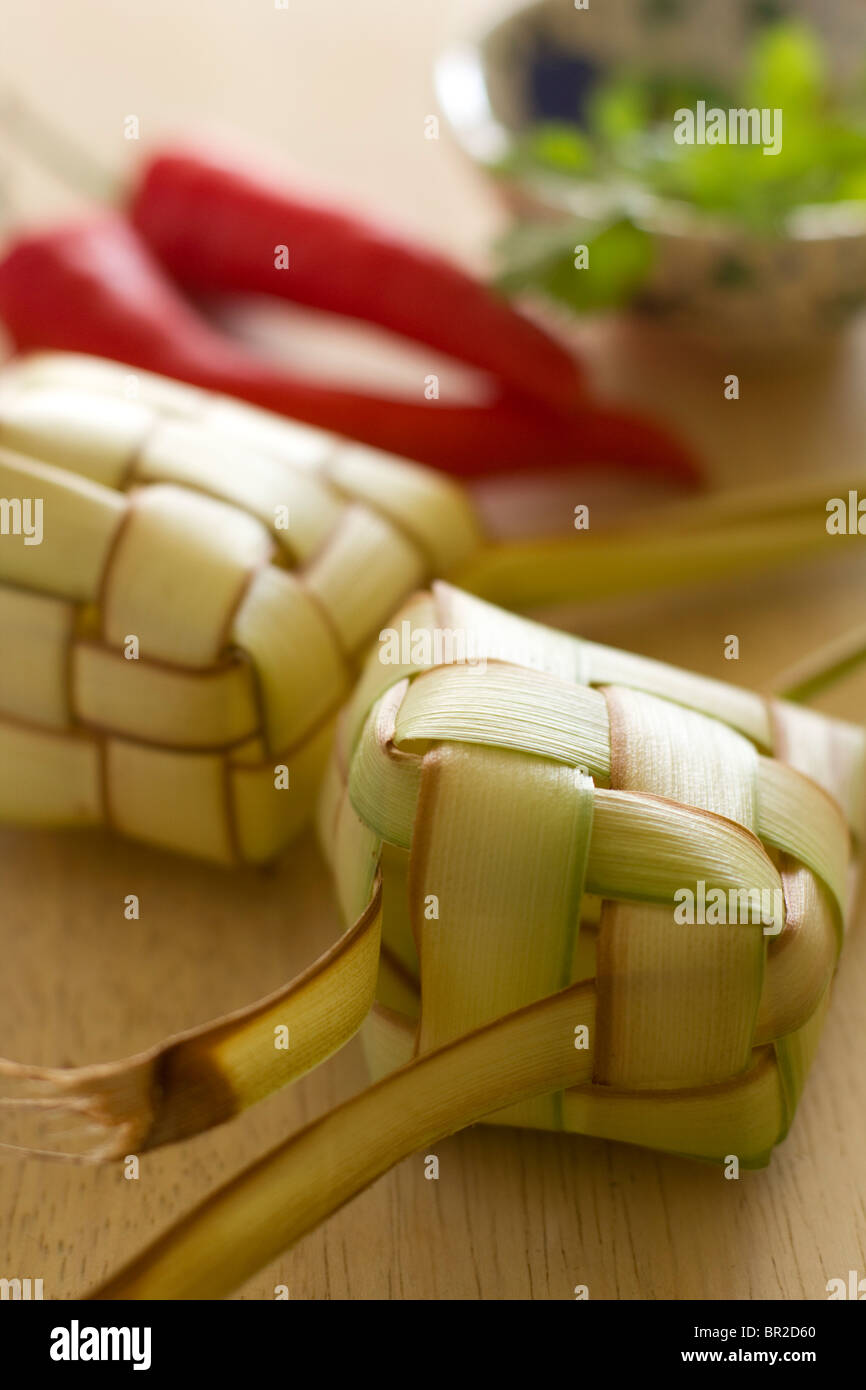 Ketupat, Malaysian sticky rice packets woven from pandan leaves and ...