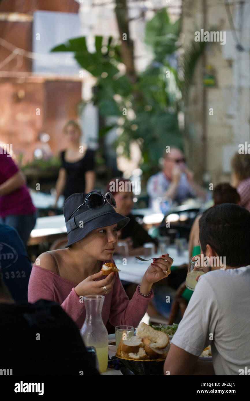Diners eating lunch at Dr. Shakshouka, a kosher Tripolitanian ...