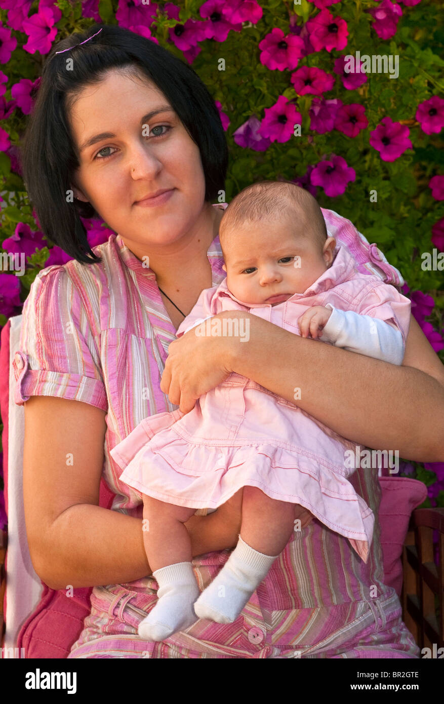 Young woman posing for portrait with baby - France Stock Photo - Alamy