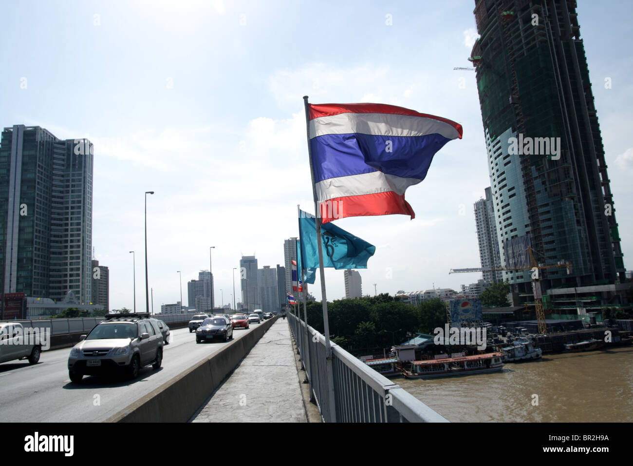 Thai flags at Sathorn bridge Stock Photo - Alamy