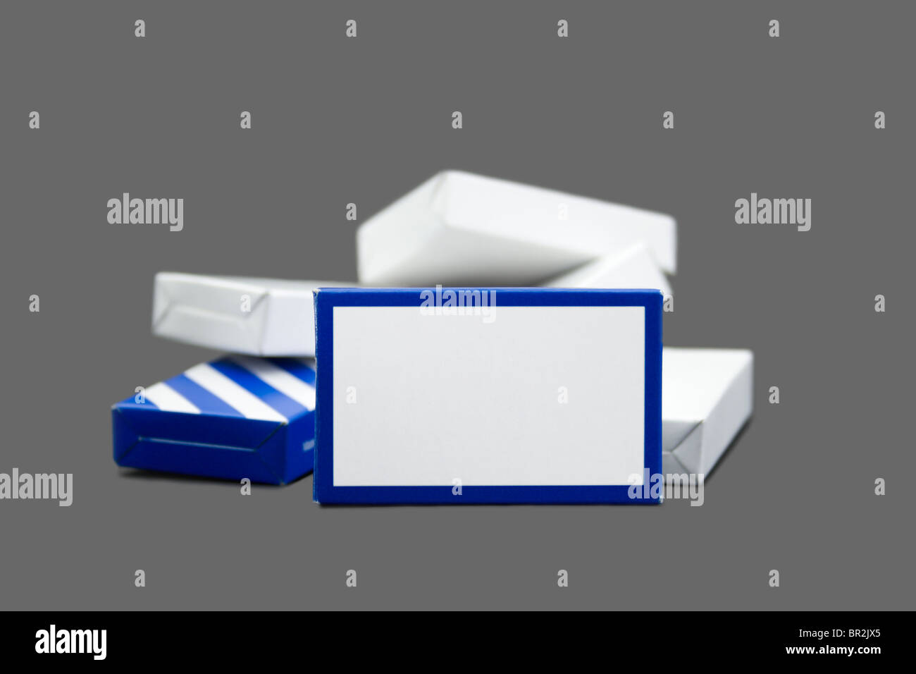 Blue striped and white carton boxes, piled heap Stock Photo - Alamy
