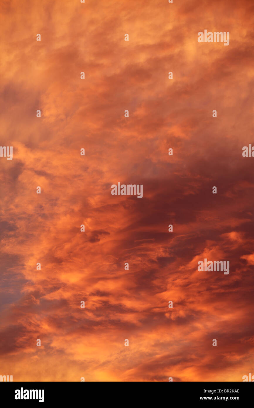Brightly colored clouds at sunset Stock Photo - Alamy