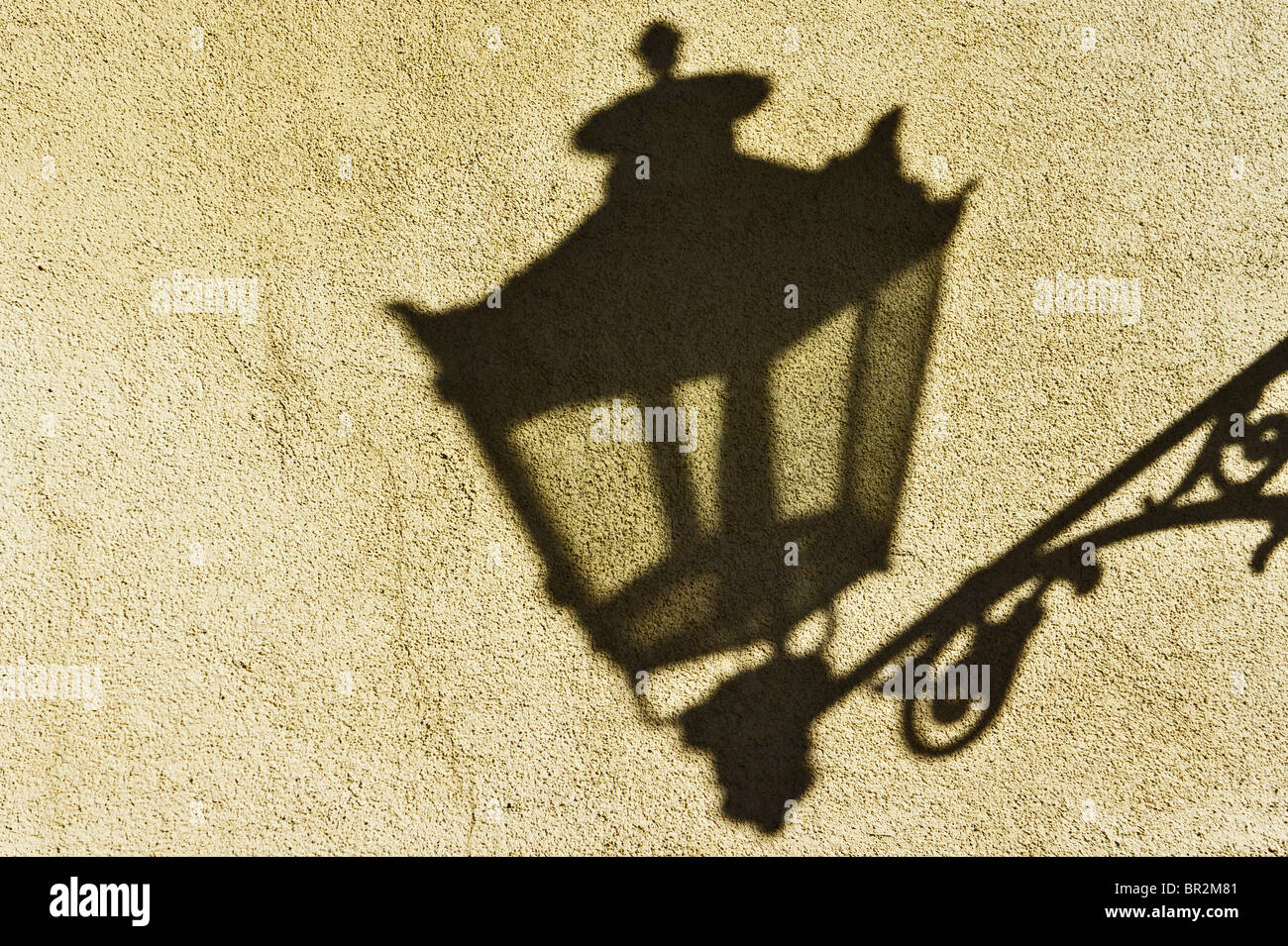 Shadow of a street lamp on a wall Stock Photo - Alamy