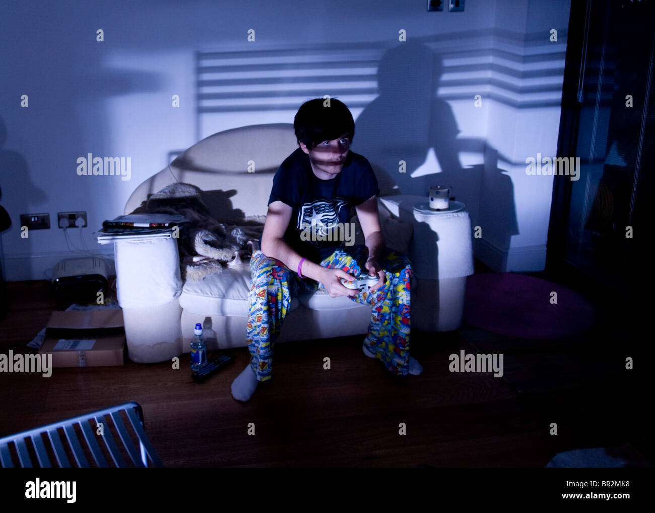 Teenager play on his Xbox 360 games console Stock Photo - Alamy