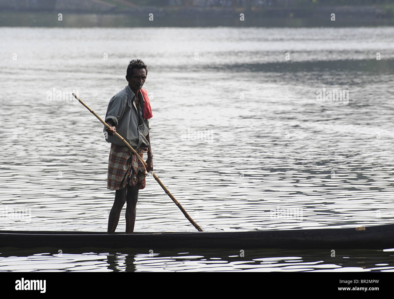 Indian man punting in kerala hi-res stock photography and images - Alamy