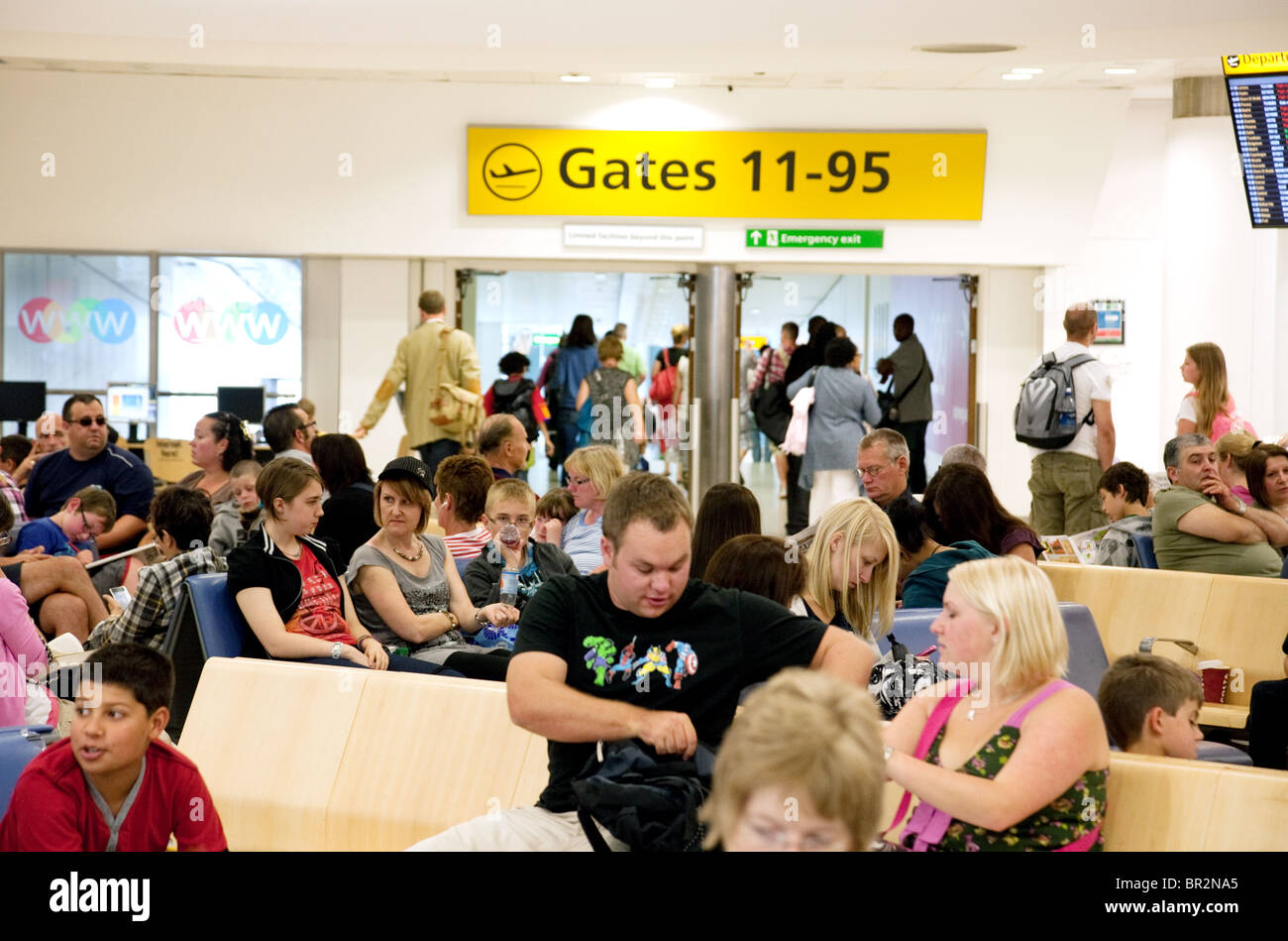 Air passengers waiting at their gate, South Terminal, Gatwick airport ...