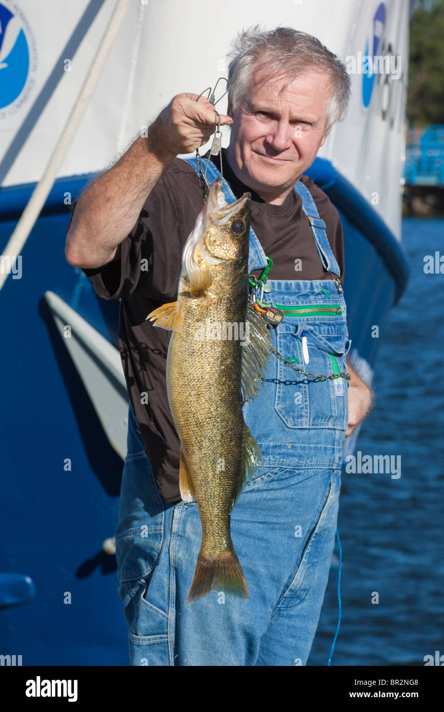 Old man holding big fish hi-res stock photography and images - Alamy