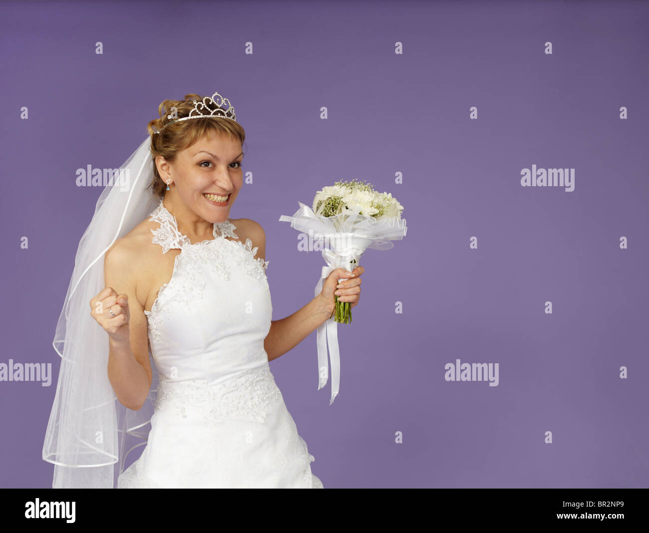 A very happy bride on a purple background Stock Photo - Alamy