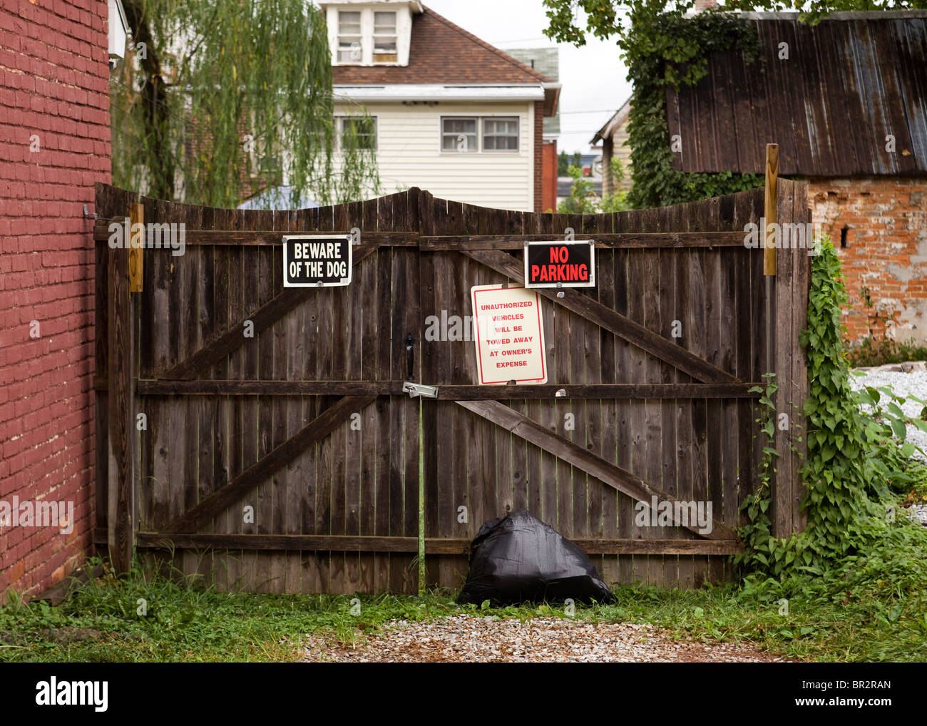 Old worn wooden gate with signs Stock Photo - Alamy