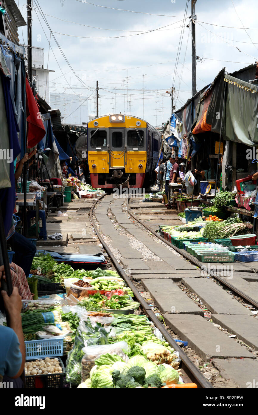 A food market on the rail tracks , Maeklong railway market , Thailand ...