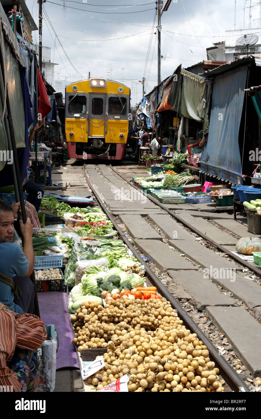 A food market on the rail tracks , Maeklong railway market , Thailand ...